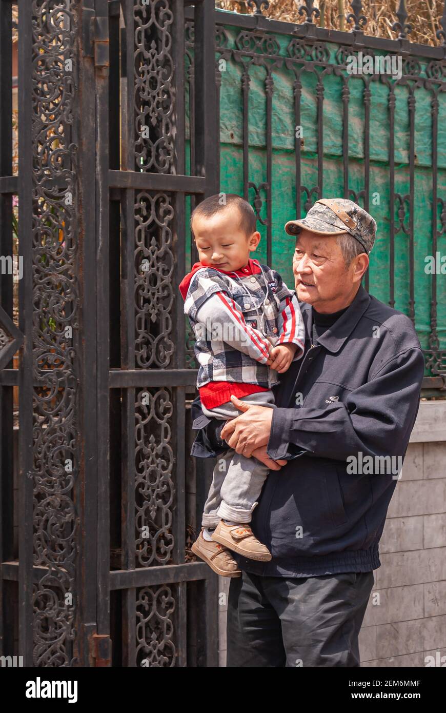 Beijing, China - April 27, 2010: Closeup of older dull-colored clothed ...