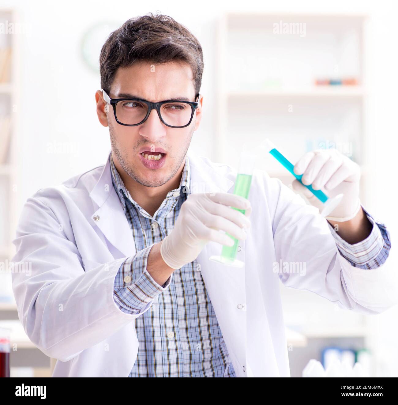 Chemistry student doing chemical experiments at classroom activity ...
