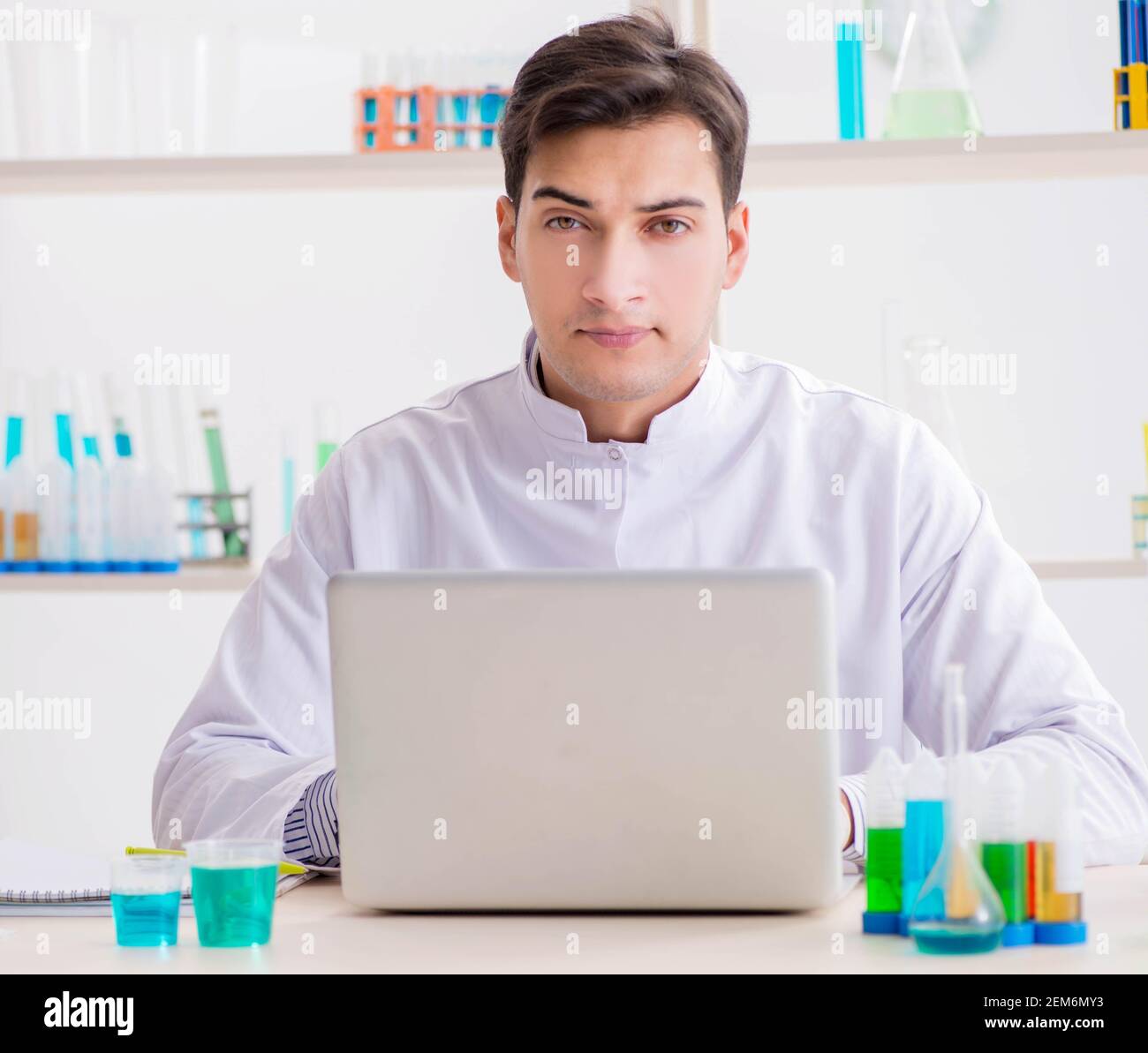 The man student working in chemical lab on experiment Stock Photo - Alamy