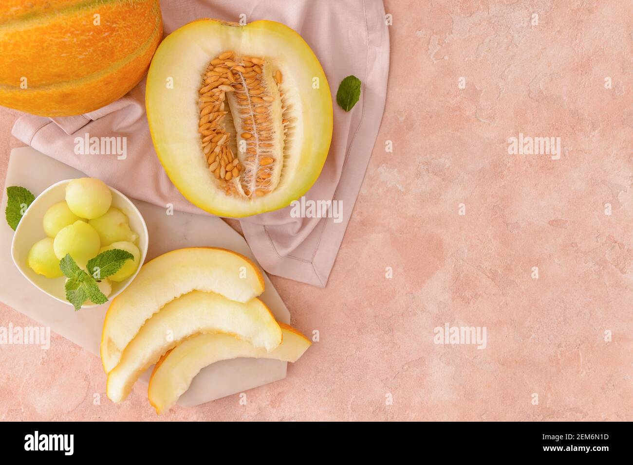 Bowl with sweet melon balls on color background Stock Photo - Alamy