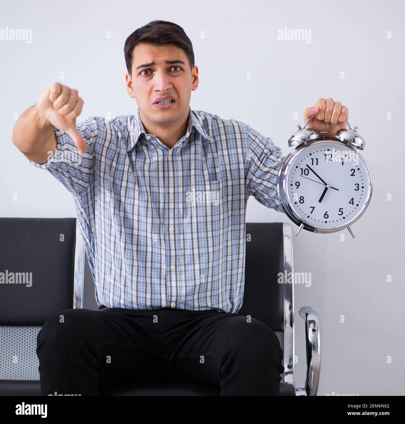 The man nervously impatiently waiting in the lobby Stock Photo - Alamy