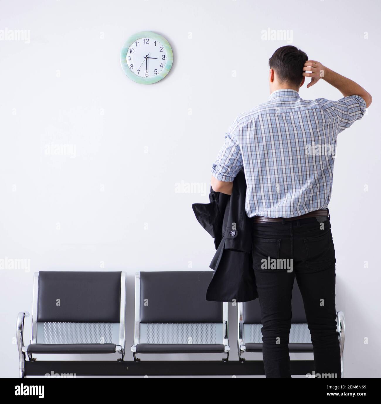 The man nervously impatiently waiting in the lobby Stock Photo - Alamy