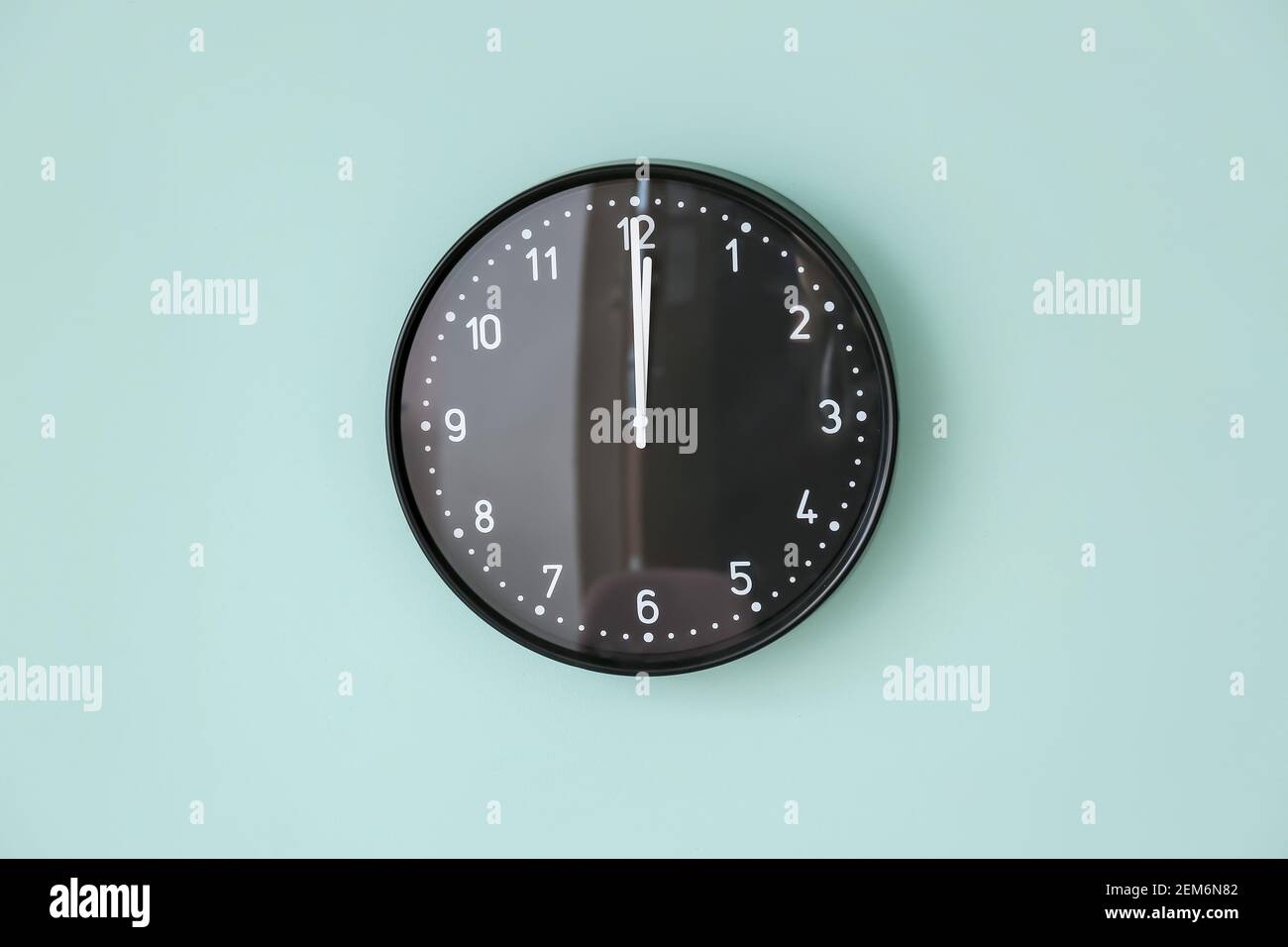 Simple clock hanging on black hi-res stock photography and images - Alamy