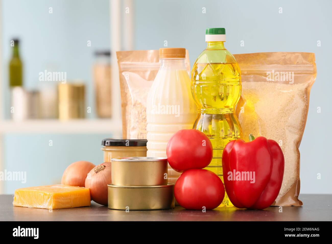 Different products on table in kitchen Stock Photo - Alamy