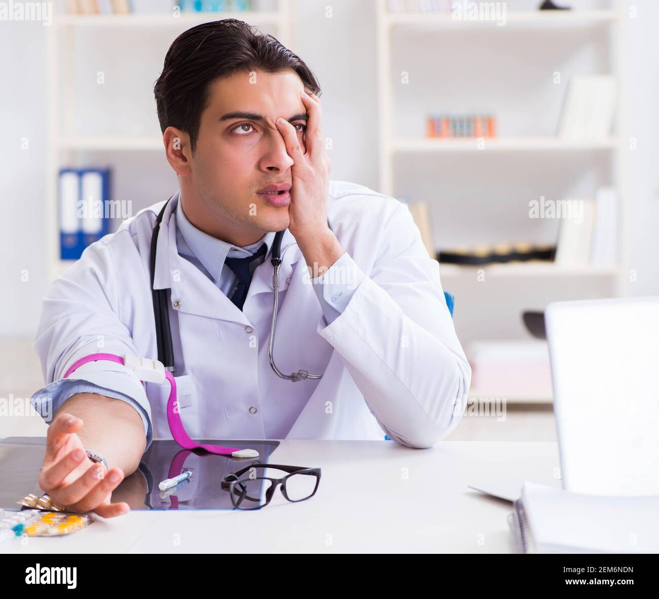 The doctor drug addict in the hospital Stock Photo - Alamy