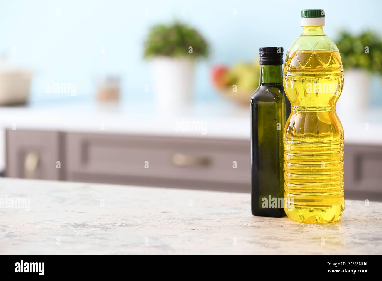 Bottles of oil on table in modern kitchen Stock Photo - Alamy