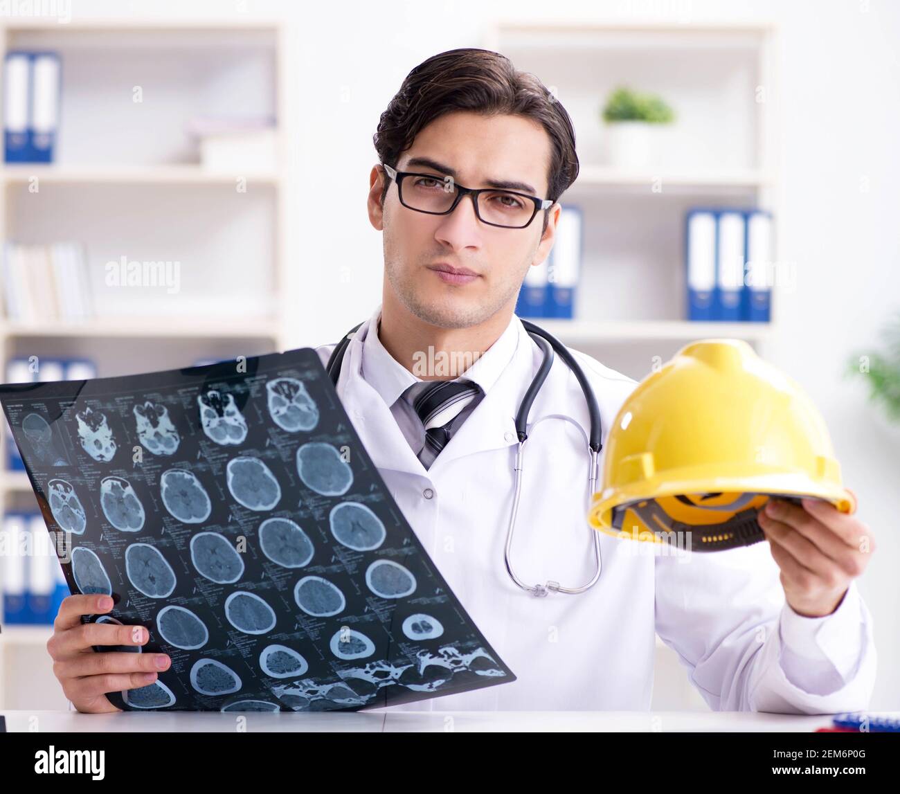 The safety doctor advising about wearing hard hat Stock Photo - Alamy