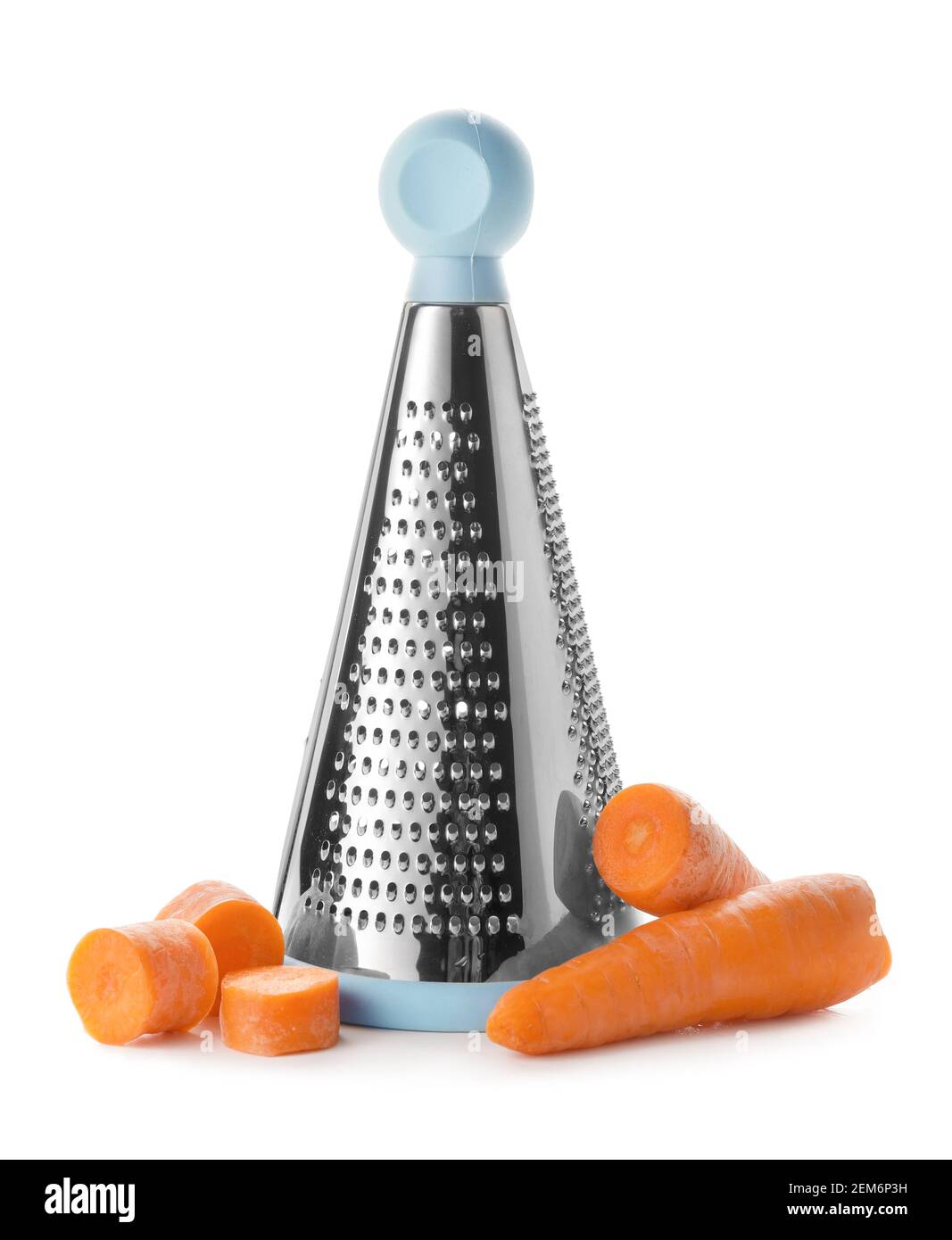 Metal grater and carrots on white background Stock Photo - Alamy