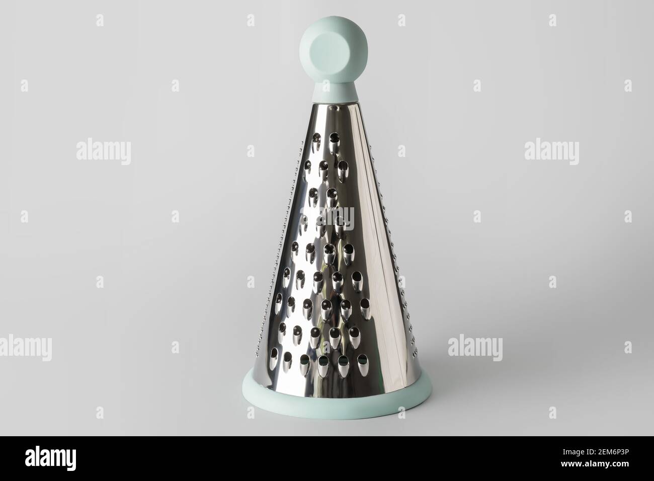 Metal grater on grey background Stock Photo - Alamy