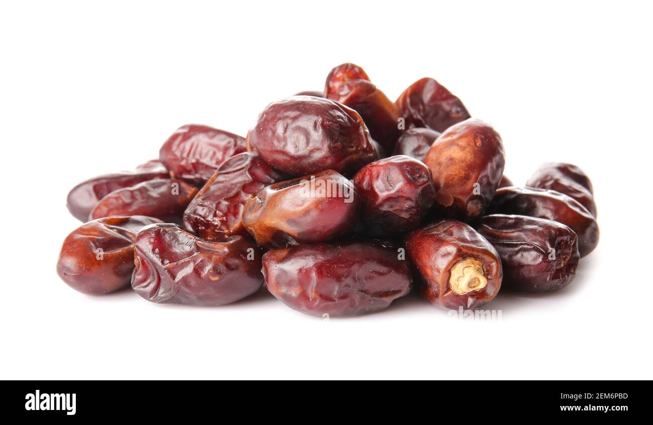 Sweet dried dates on white background Stock Photo - Alamy
