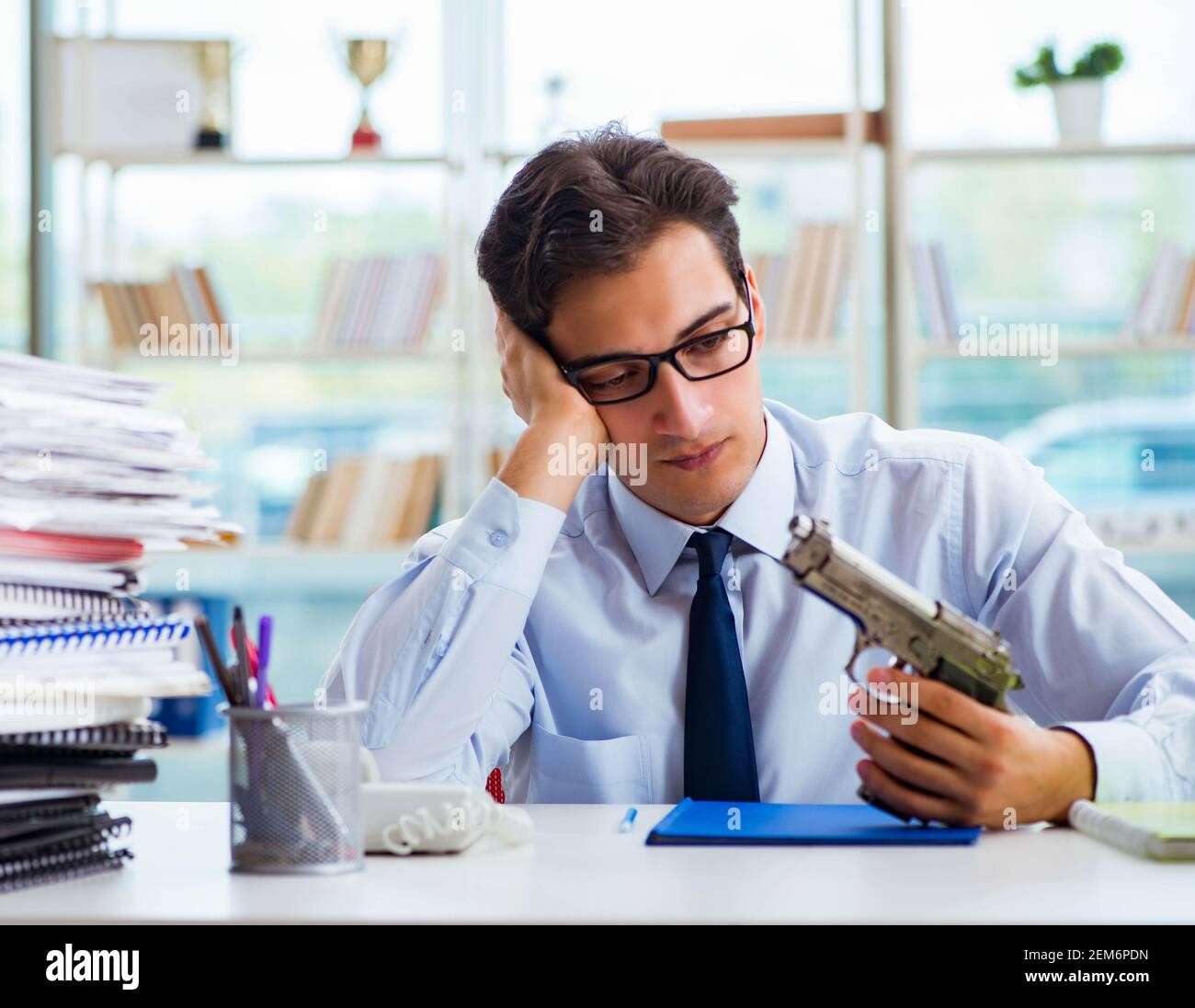 The angry businessman with gun thinking of committing suicide Stock ...