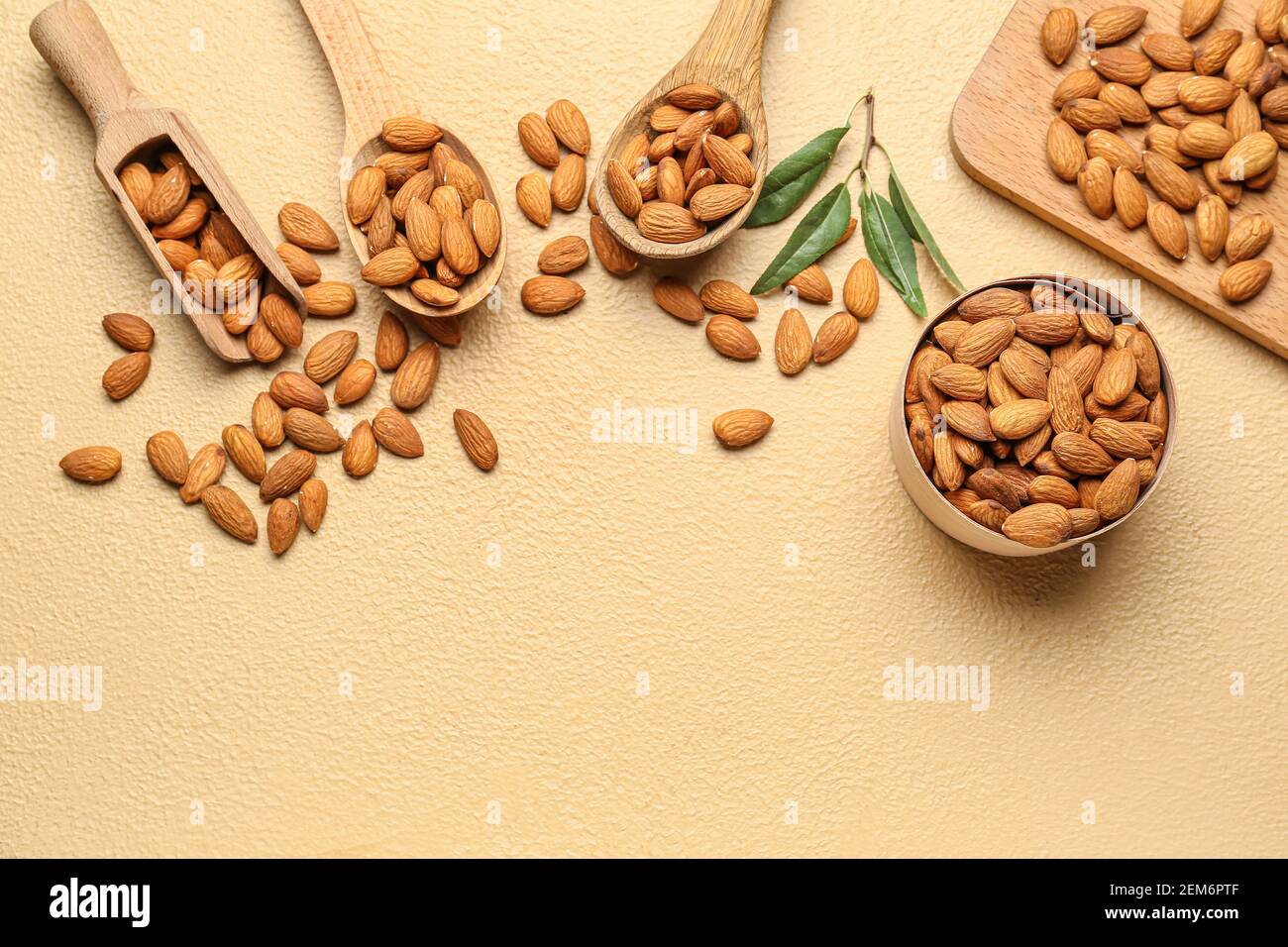 Composition with healthy almonds on color background Stock Photo - Alamy