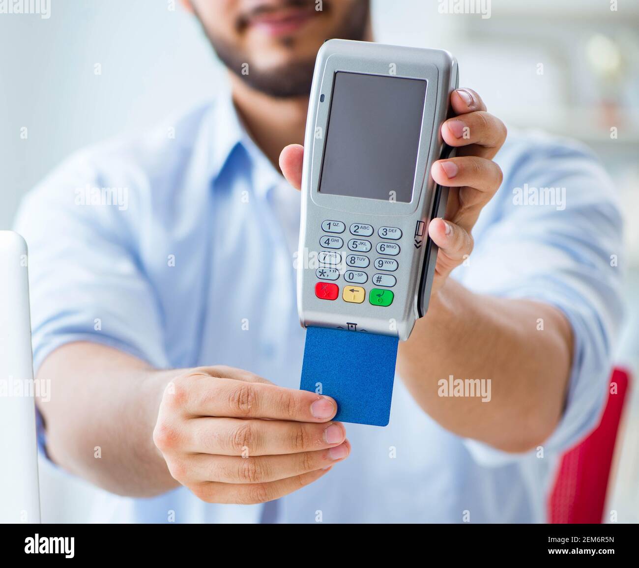 The man processing credit card transaction with pos terminal Stock ...