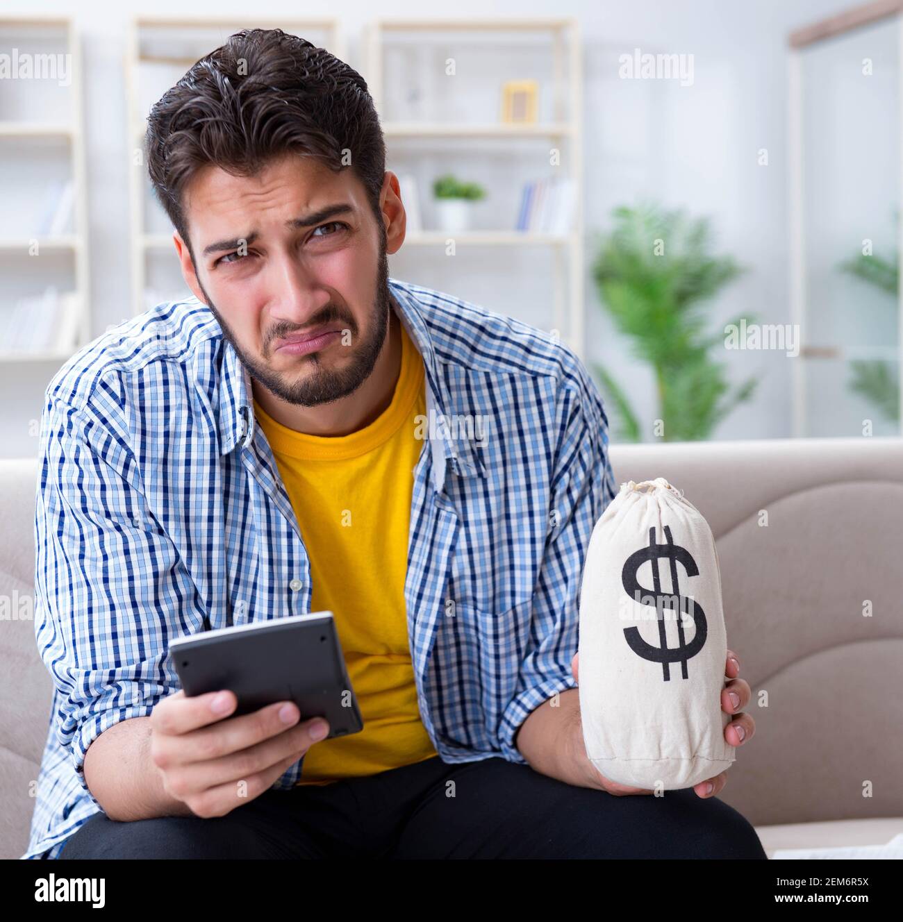 The man angry at bills he needs to pay Stock Photo - Alamy