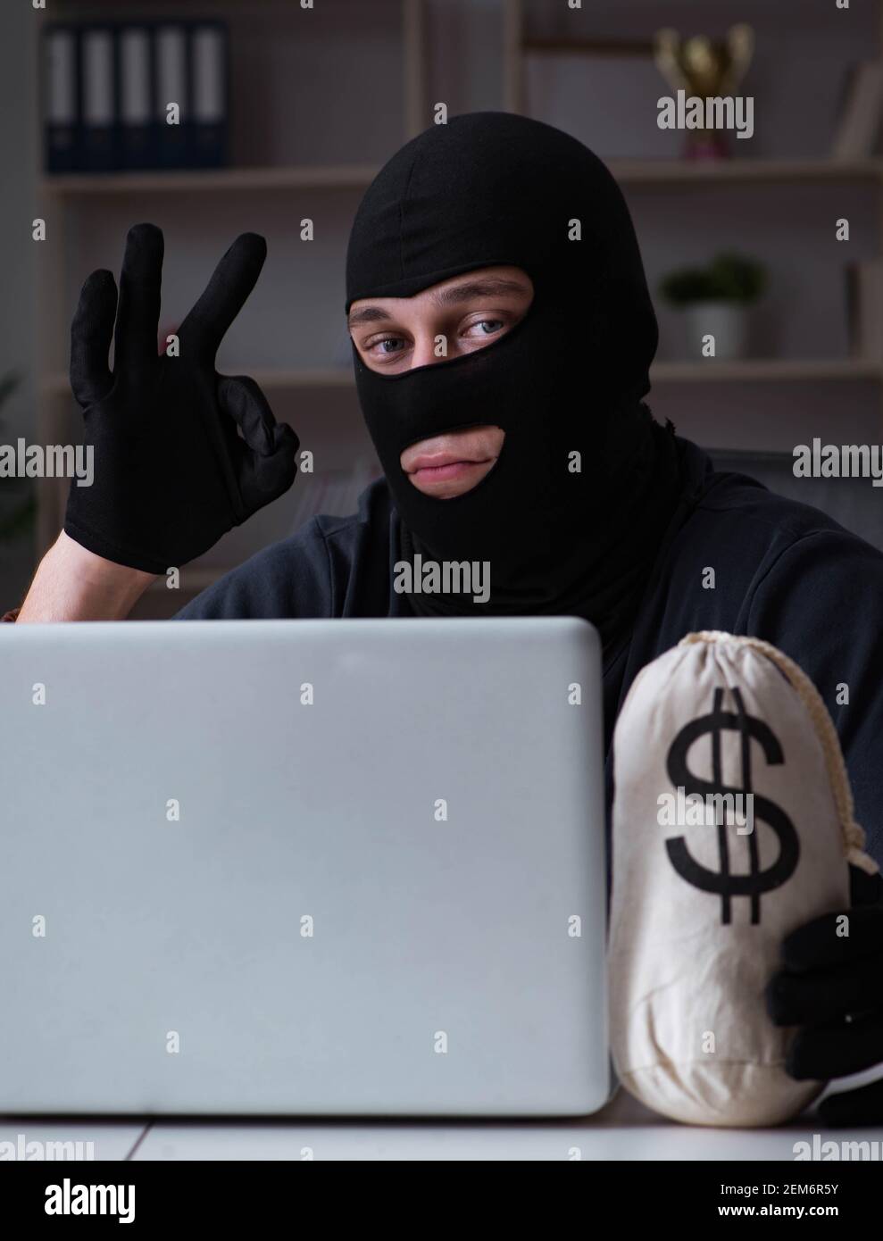 The hacker hacking computer late at night Stock Photo - Alamy