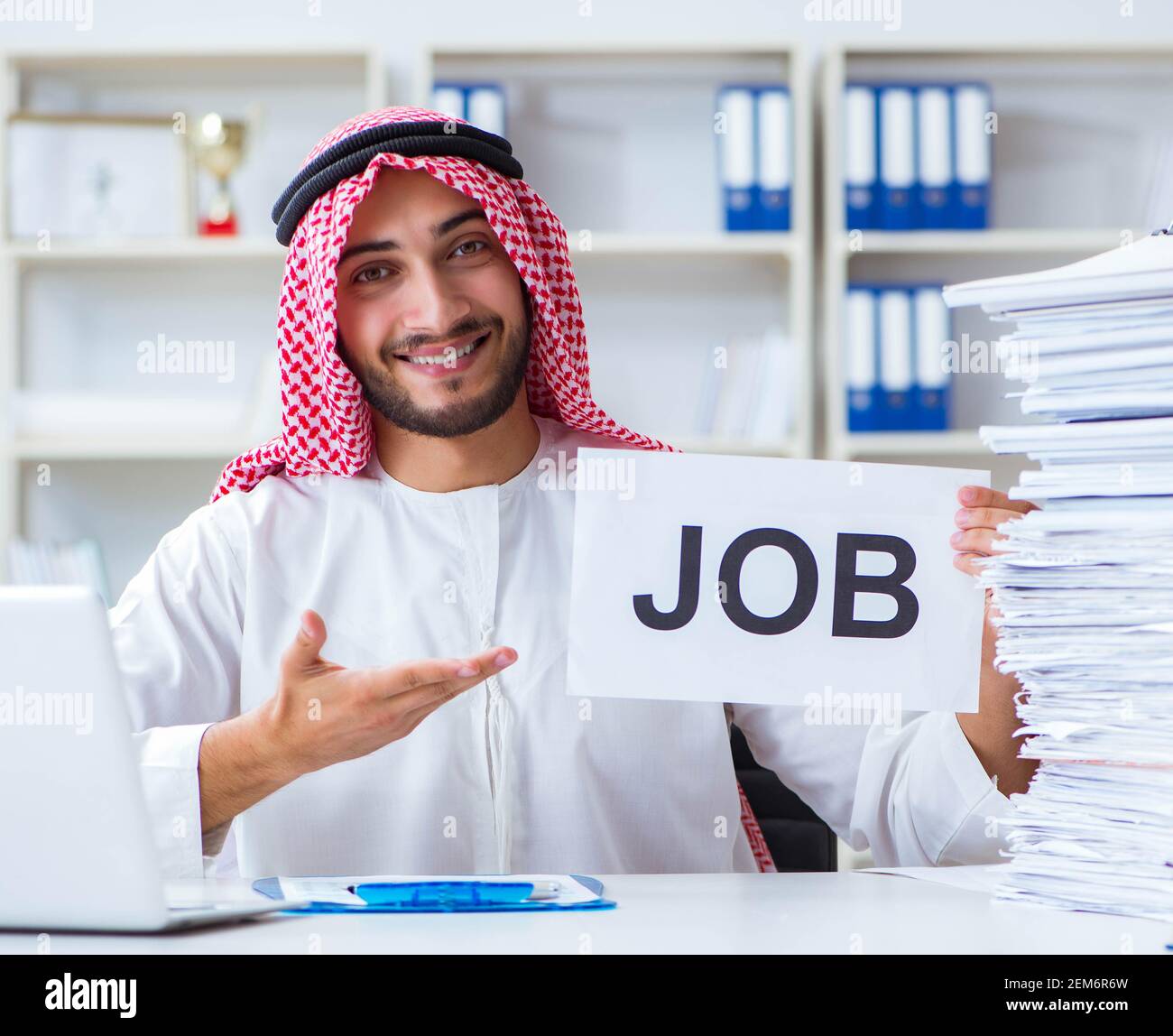The arab man sitting at desk with message Stock Photo - Alamy