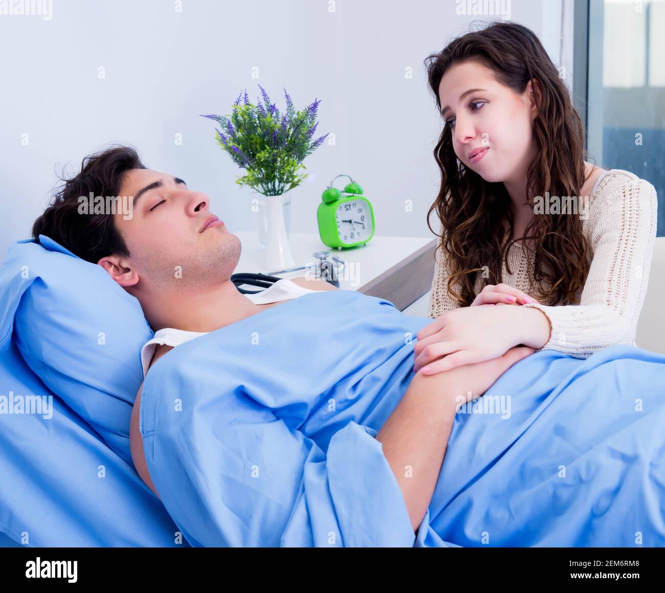 The wife visiting ill husband in the hospital room Stock Photo - Alamy