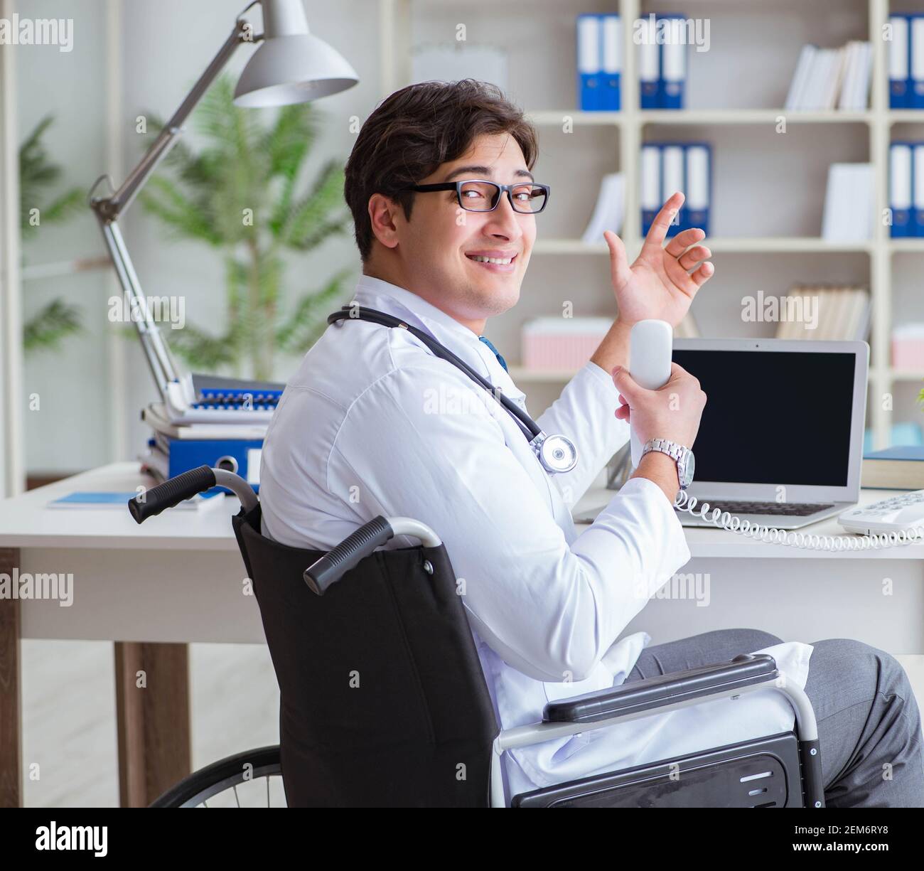 The disabled doctor on wheelchair working in hospital Stock Photo - Alamy