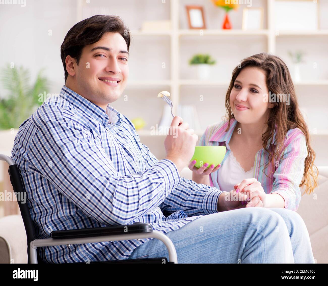 The young family taking care of each other Stock Photo - Alamy