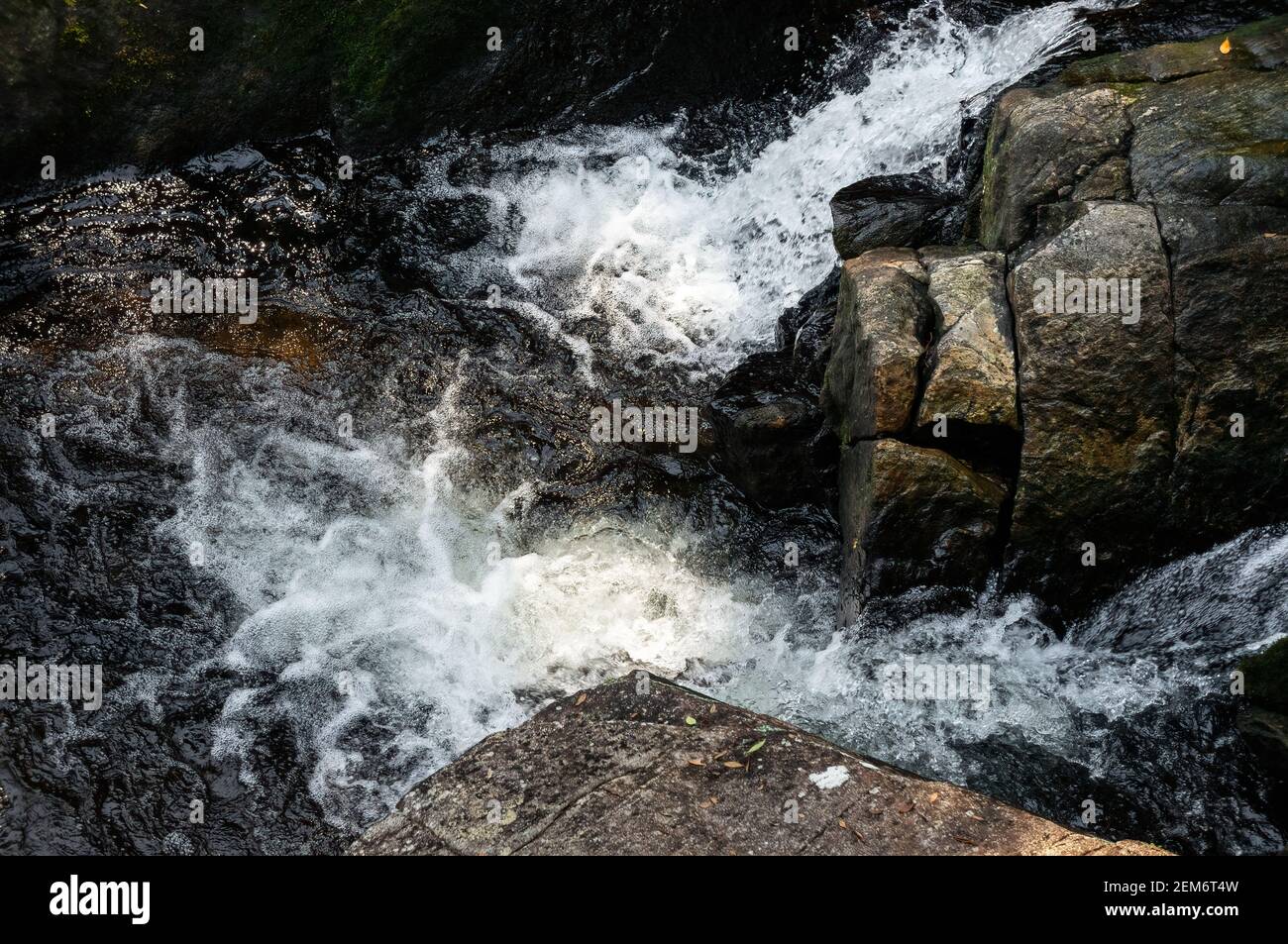 A big water current flowing around rock formations from Ipiranguinha ...