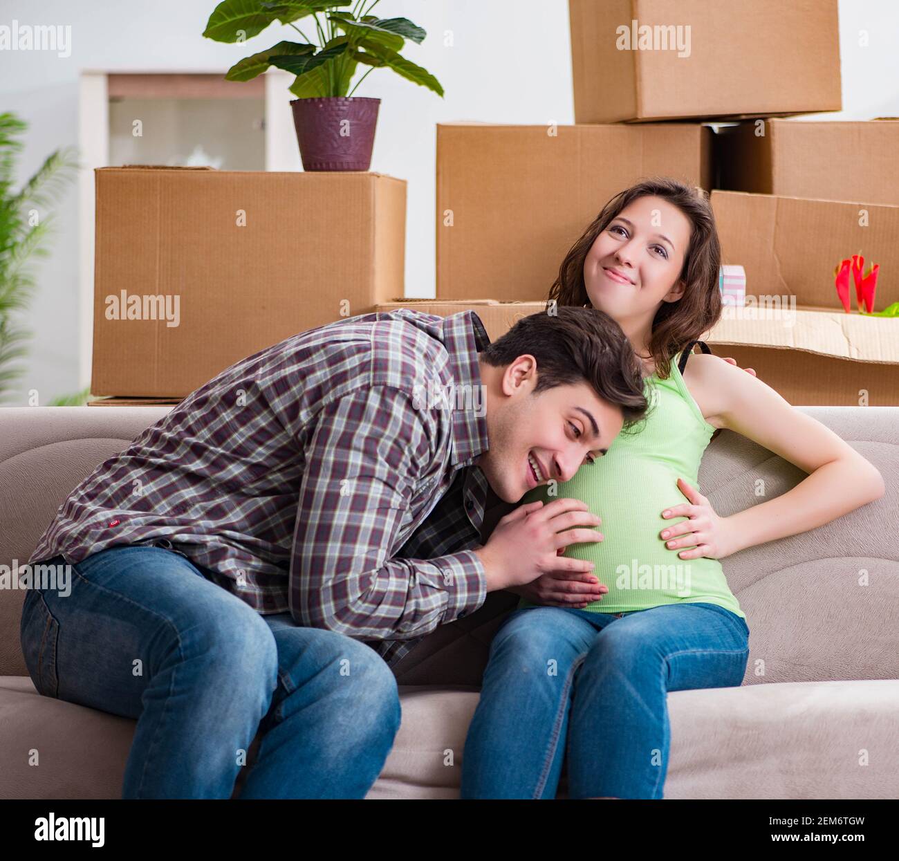 The young couple of man and pregnant wife expecting baby Stock Photo ...