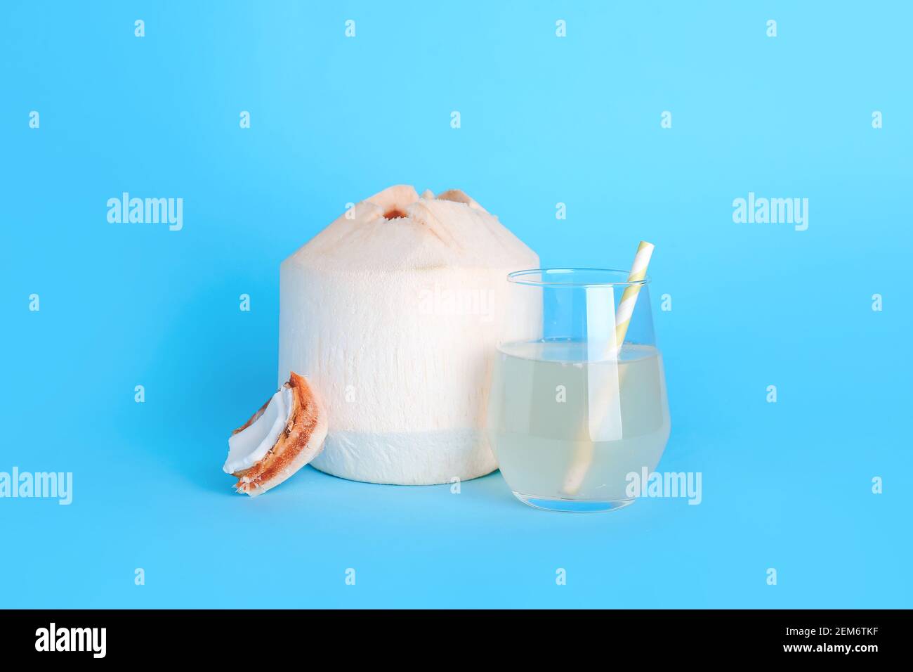 Fresh coconut on color background Stock Photo - Alamy