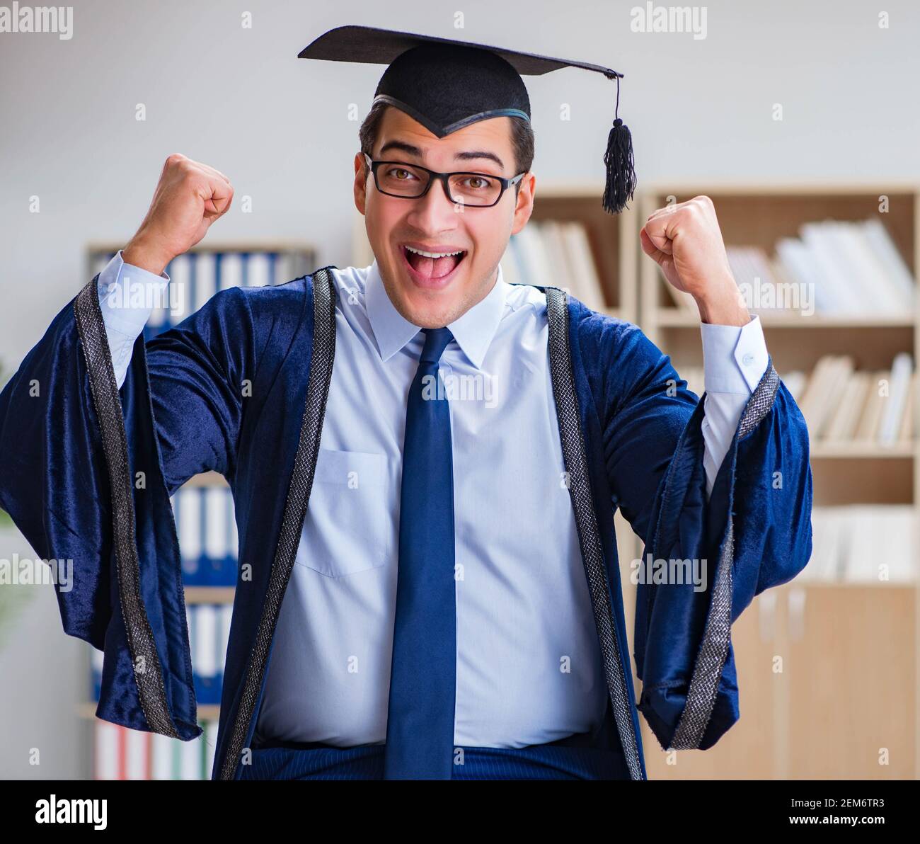 The young man graduating from university Stock Photo - Alamy