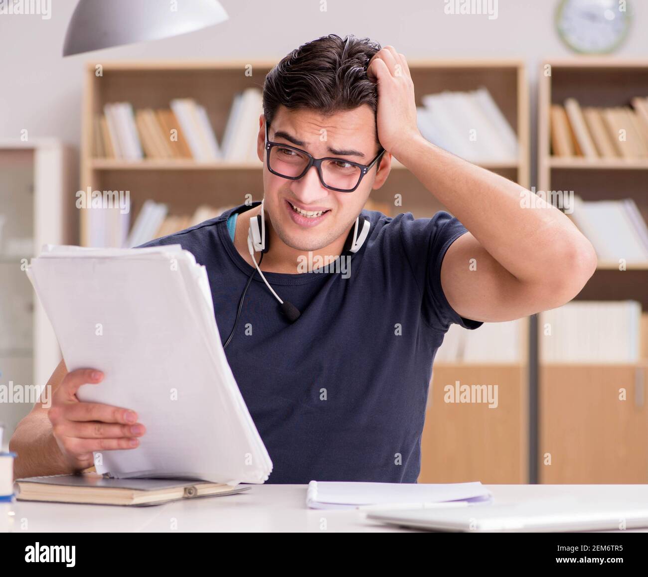 The unhappy student with too much to study Stock Photo - Alamy
