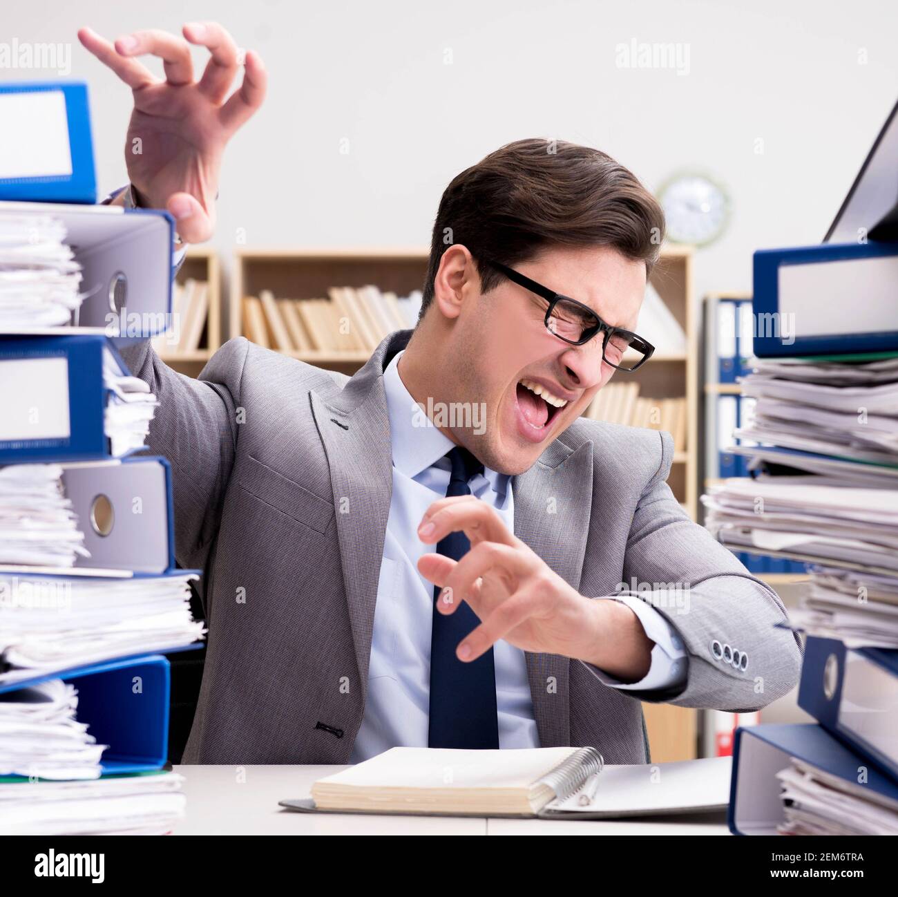 The busy businessman under stress due to excessive work Stock Photo - Alamy