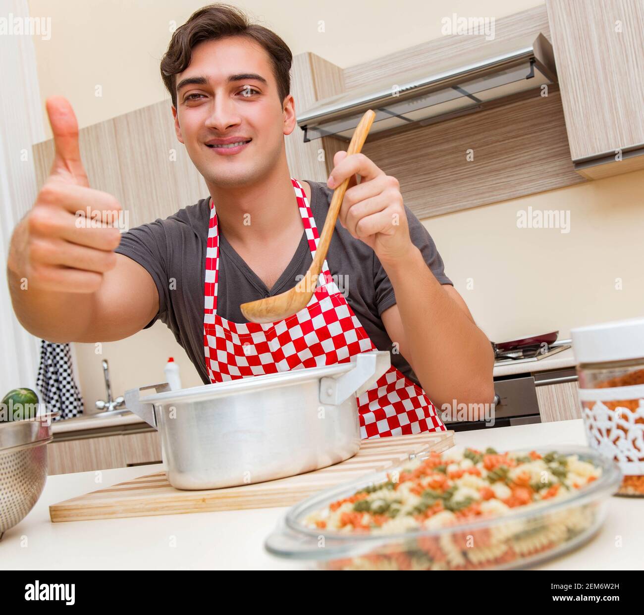 The man male cook preparing food in kitchen Stock Photo - Alamy