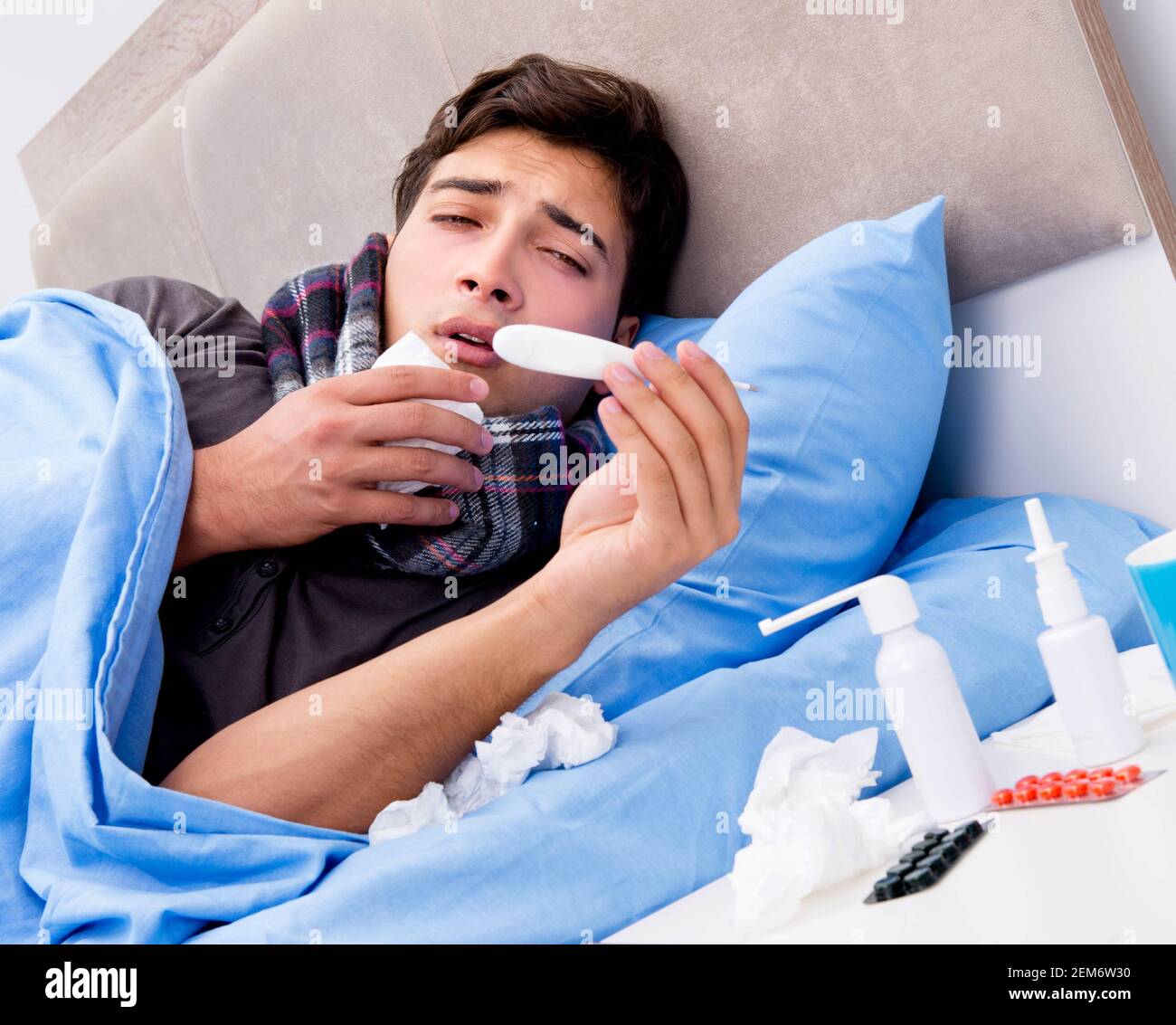 The sick ill man in the bed taking medicines and drugs Stock Photo - Alamy