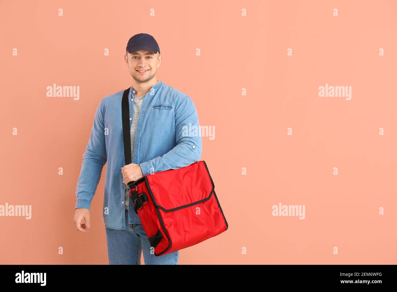 Courier of food delivery service on color background Stock Photo - Alamy