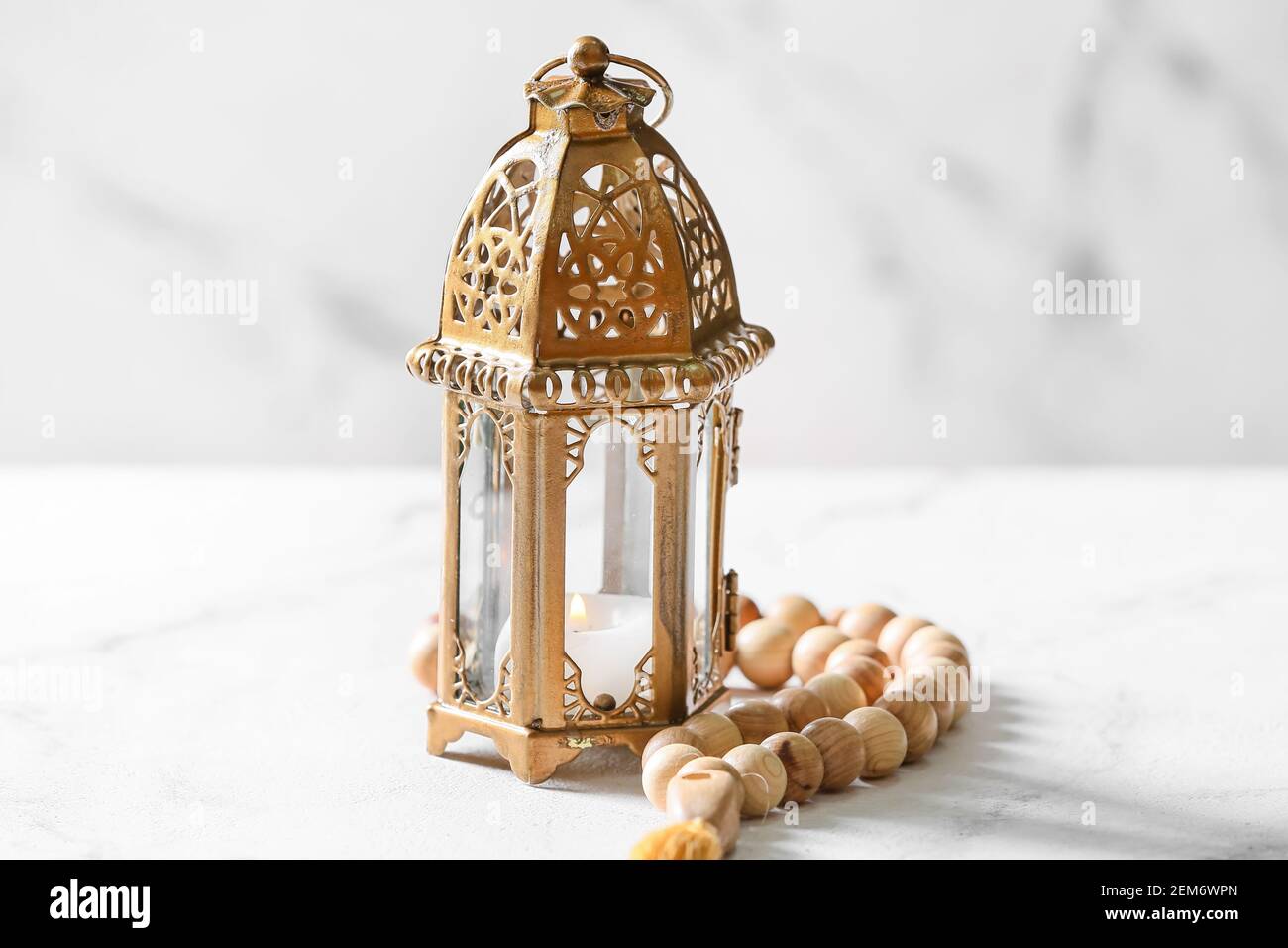 Muslim lamp and tasbih on white background Stock Photo - Alamy