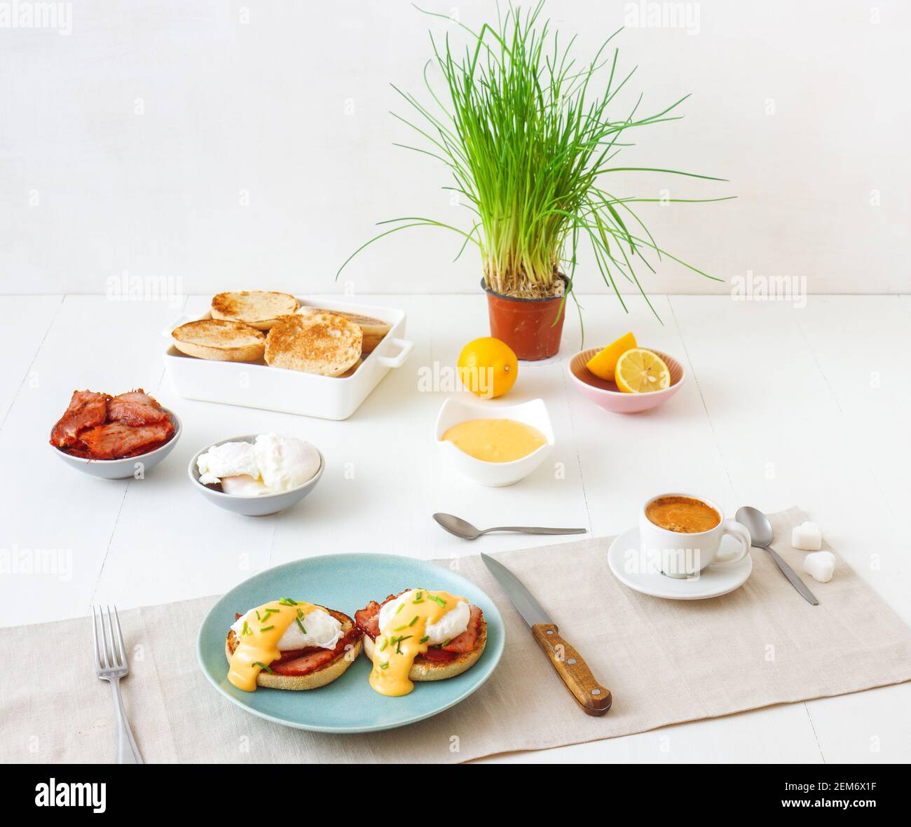 Eggs Benedict, English muffins, grilled ham, poached eggs, Hollandaise ...