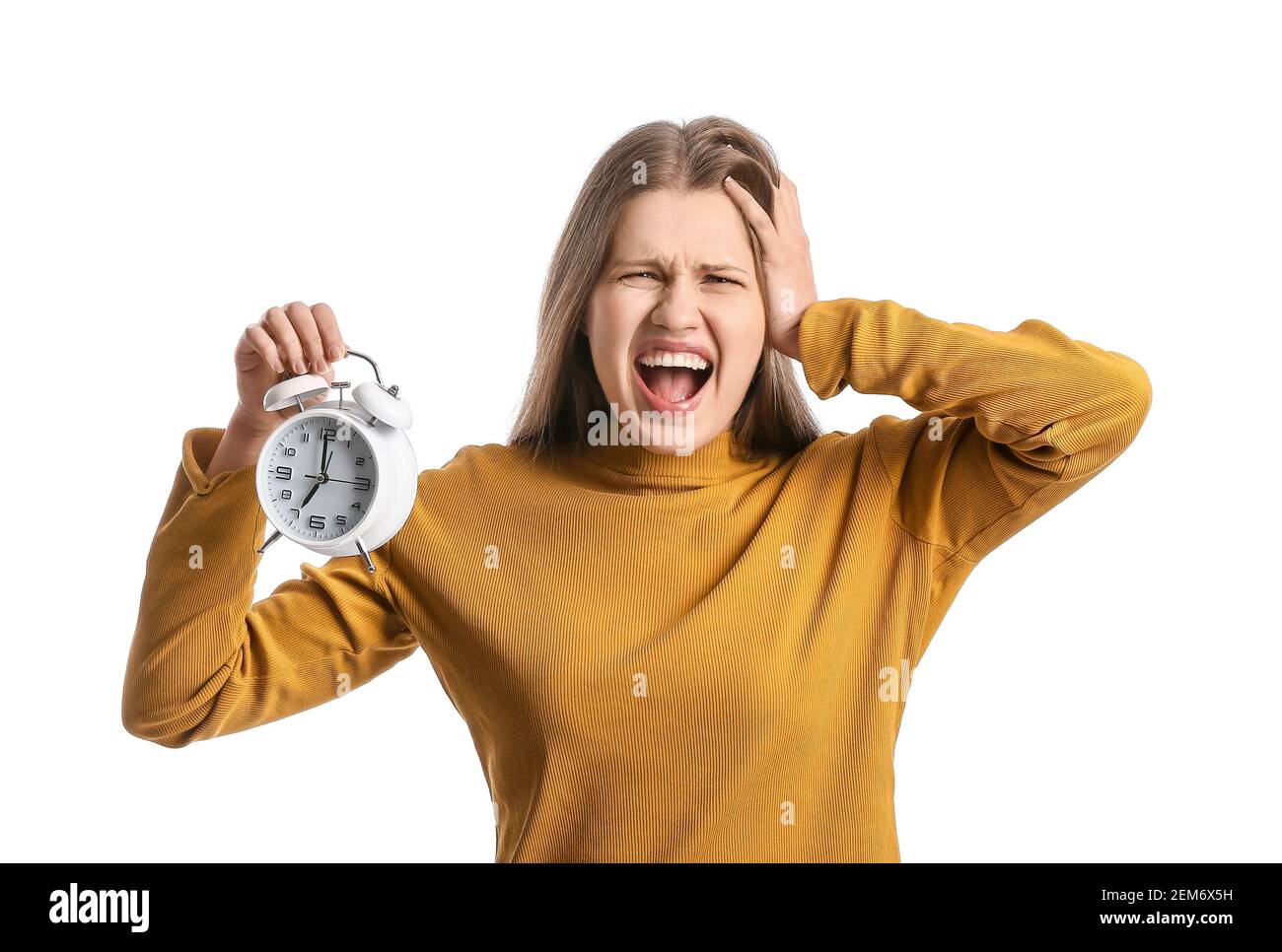 Stressed young woman with clock on white background Stock Photo - Alamy