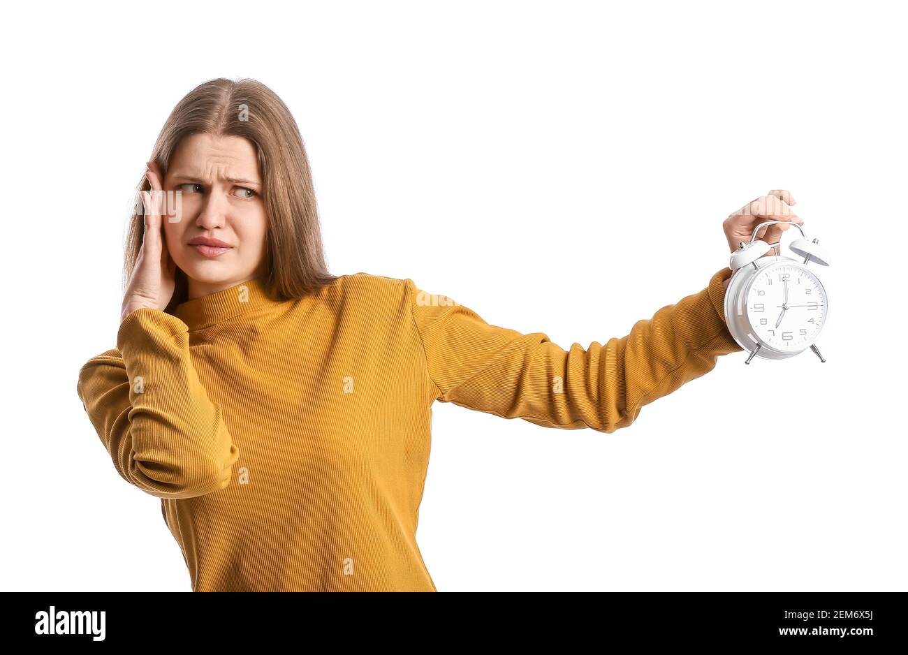 Stressed young woman with clock on white background Stock Photo - Alamy