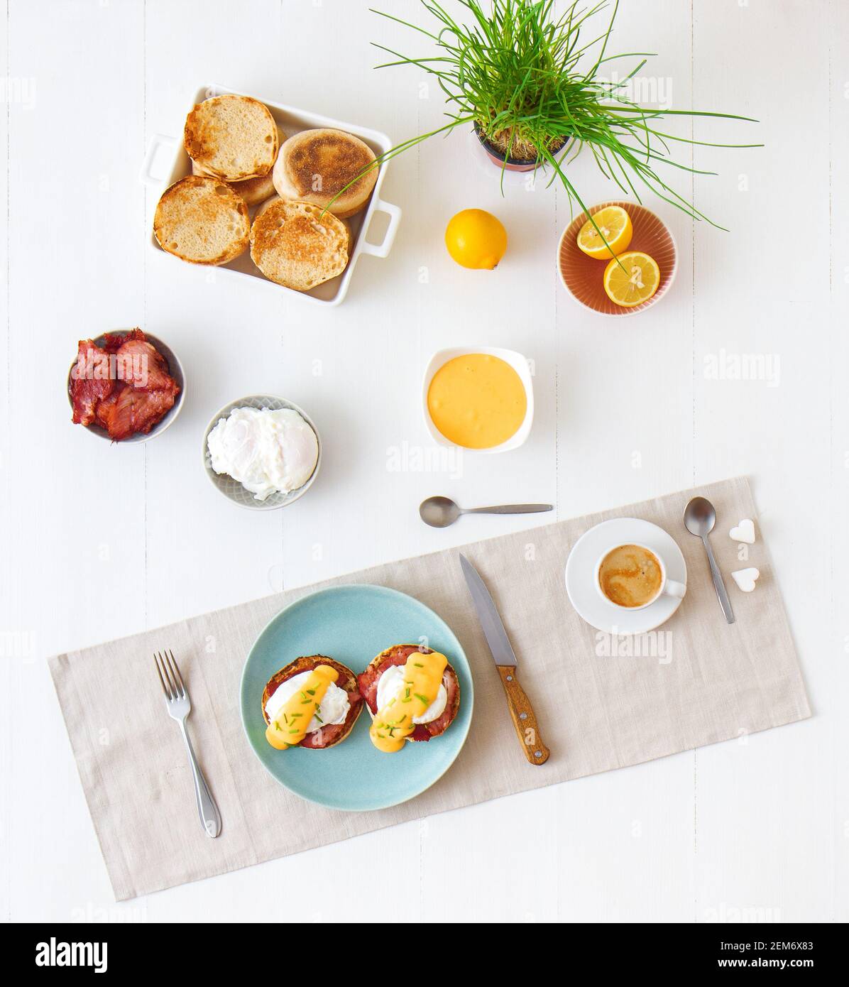 Eggs Benedict, English muffins, grilled ham, poached eggs, Hollandaise ...