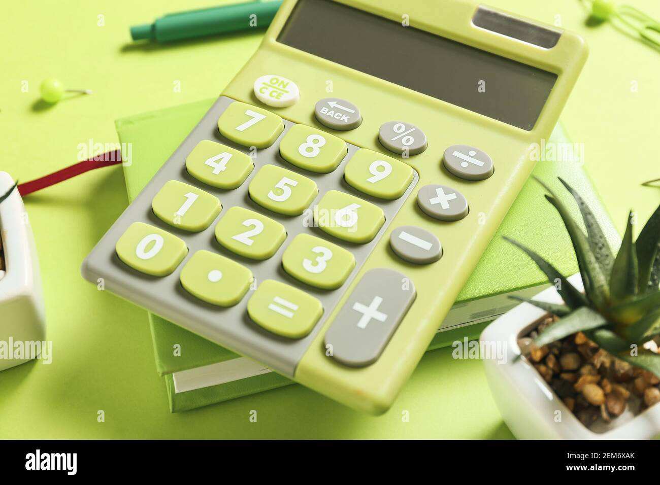 Modern calculator and stationery on color background Stock Photo - Alamy