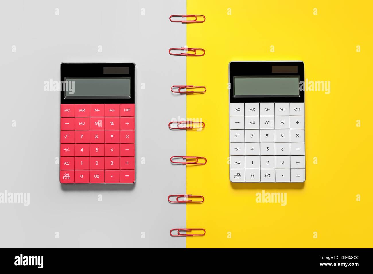 Modern calculators on color background Stock Photo - Alamy