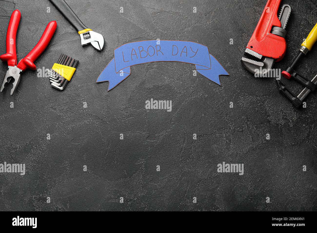 Set of tools on dark background. Labor Day celebration Stock Photo - Alamy