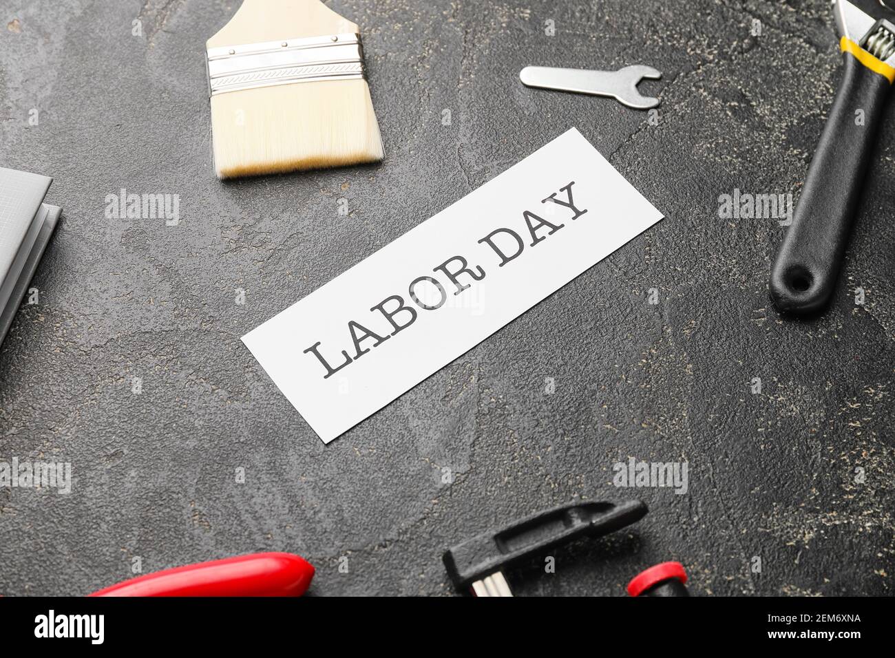 Set of tools on dark background. Labor Day celebration Stock Photo - Alamy
