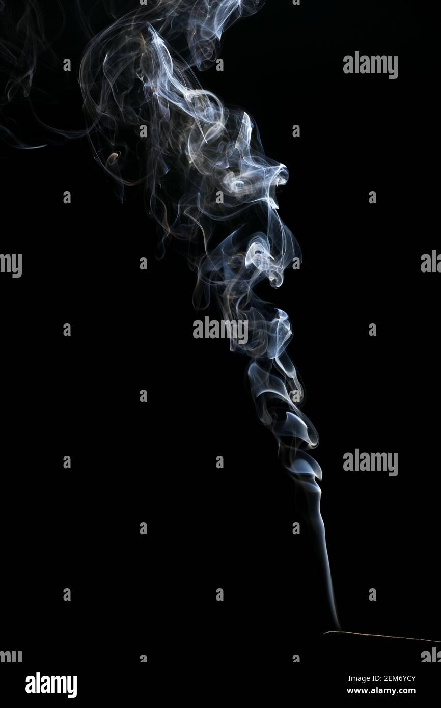 Cigarette smoke on dark background Stock Photo - Alamy