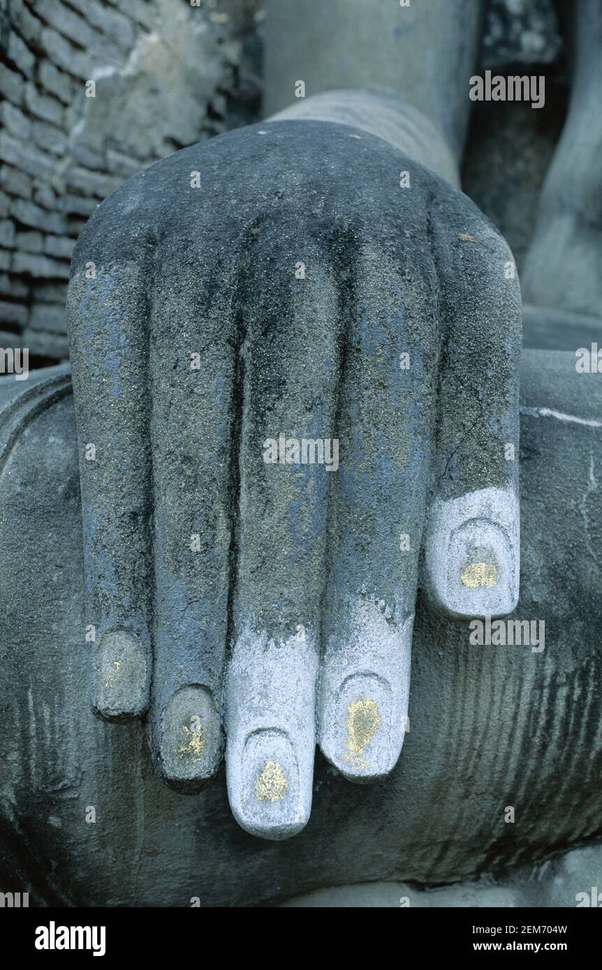 Asia,Thailand, Sukhothai, Wat Si Chum Buddhist temple,Hand and fingers ...