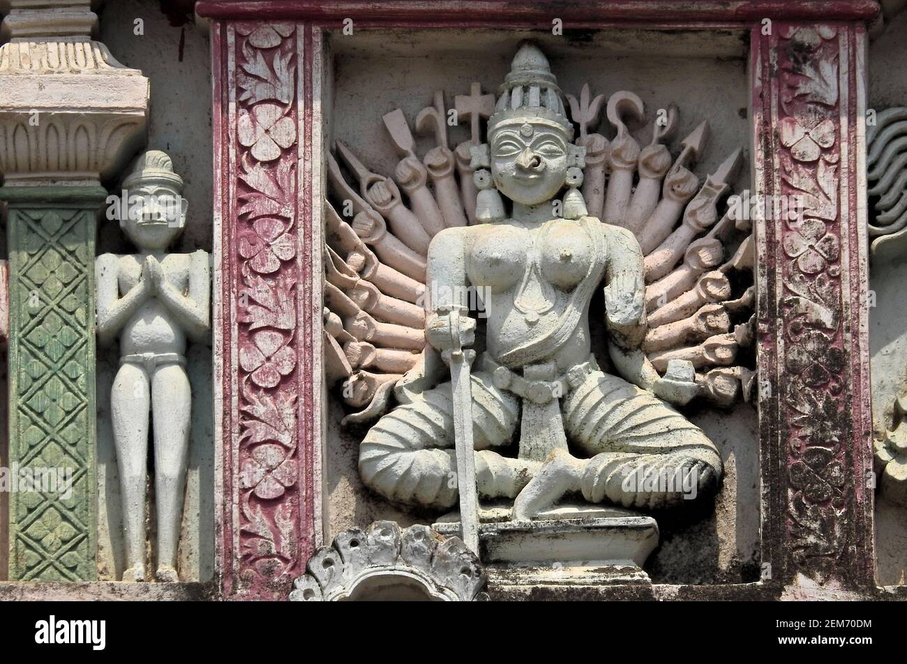 Close-up view of Indian Hindu Goddess Durga statue oh a temple wall or ...