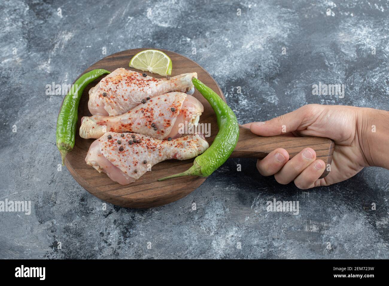Chicken drumstick hand hi-res stock photography and images - Alamy