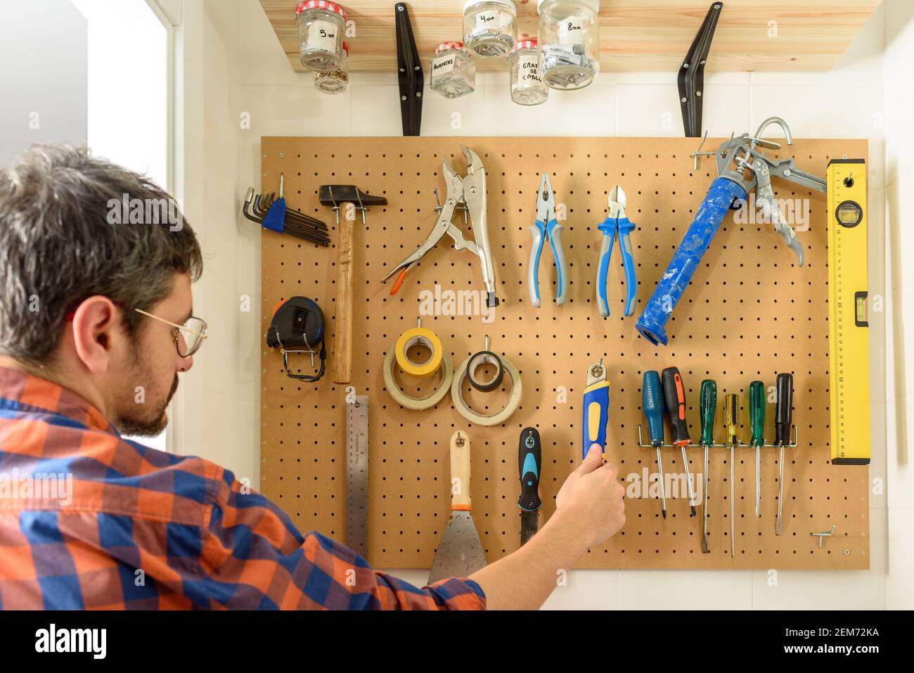 Hammer man hanging hi-res stock photography and images - Alamy