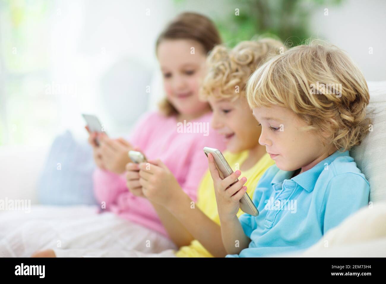 Kids with mobile phone. Child with tablet computer watching movie or ...