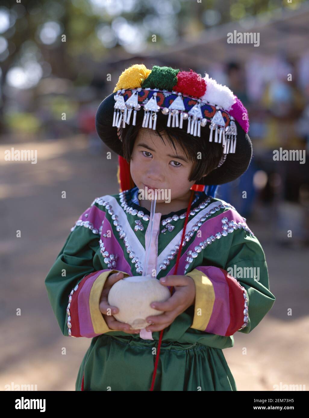 Asia, Thailand,Chiang Rai, portrait of colourful hill tribe girl ...