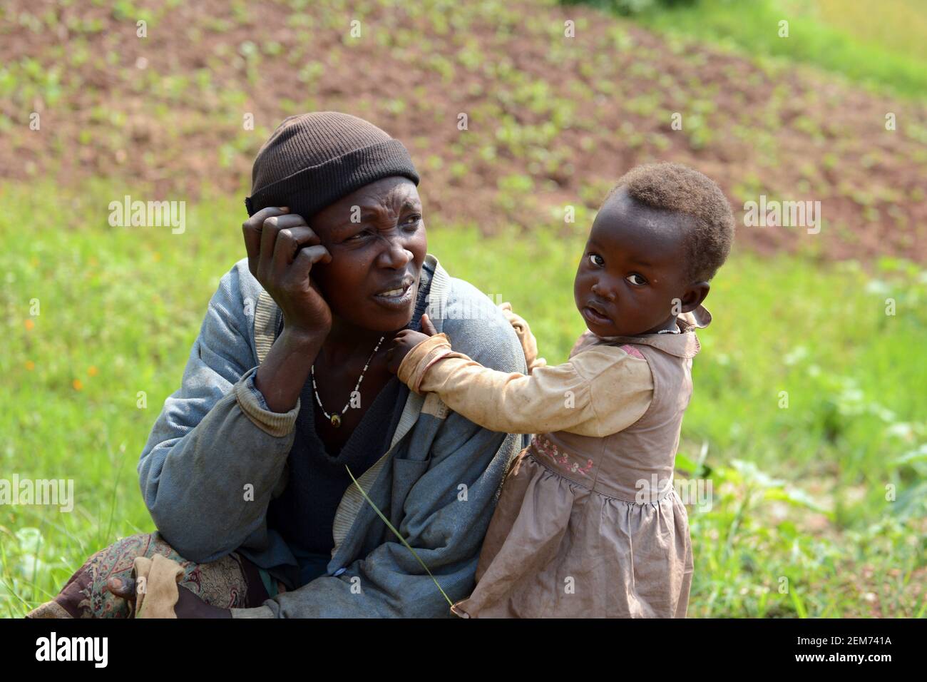 A Rwandan woman with her baby Stock Photo - Alamy
