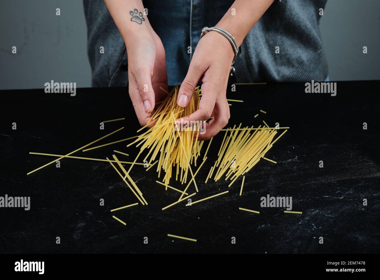 Woman holding raw pasta hi-res stock photography and images - Alamy